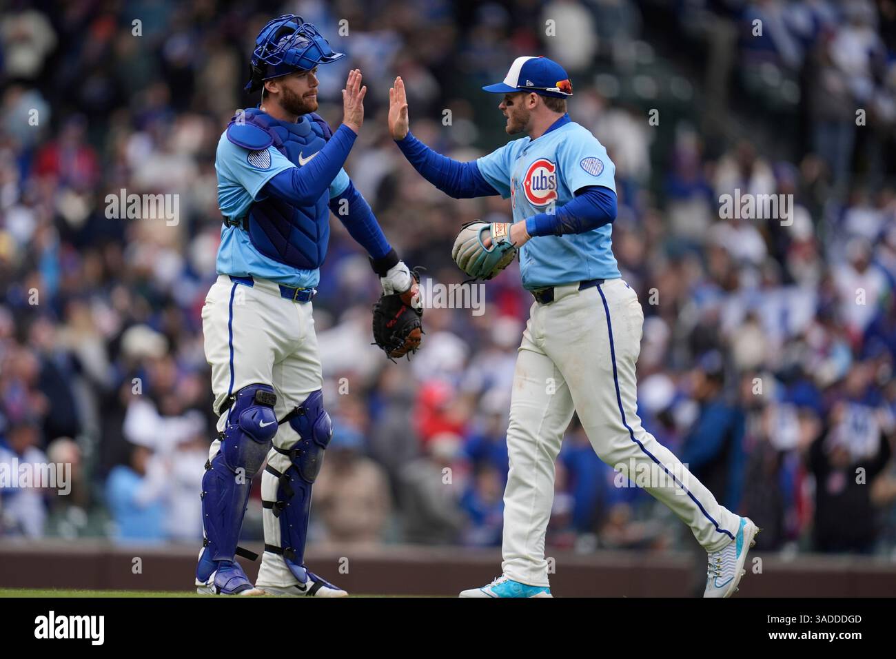 Chicago Cubs catcher Carson Kelly (15), left, and Ian Happ celebrate ...