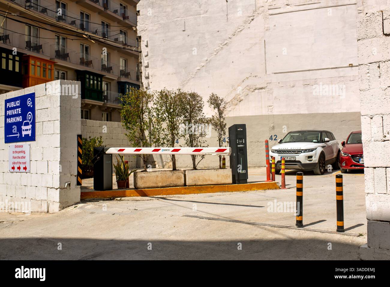 Gzira, Malta - 04/05/2025: City parking with entry barrier, public and ...