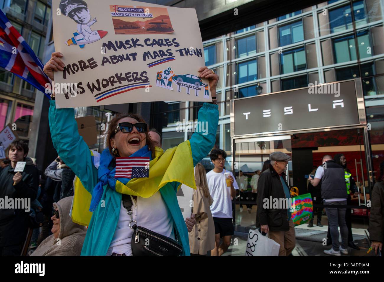 London, Westminster, UK. 19th Mar, 2025. An activist holds a placard ...