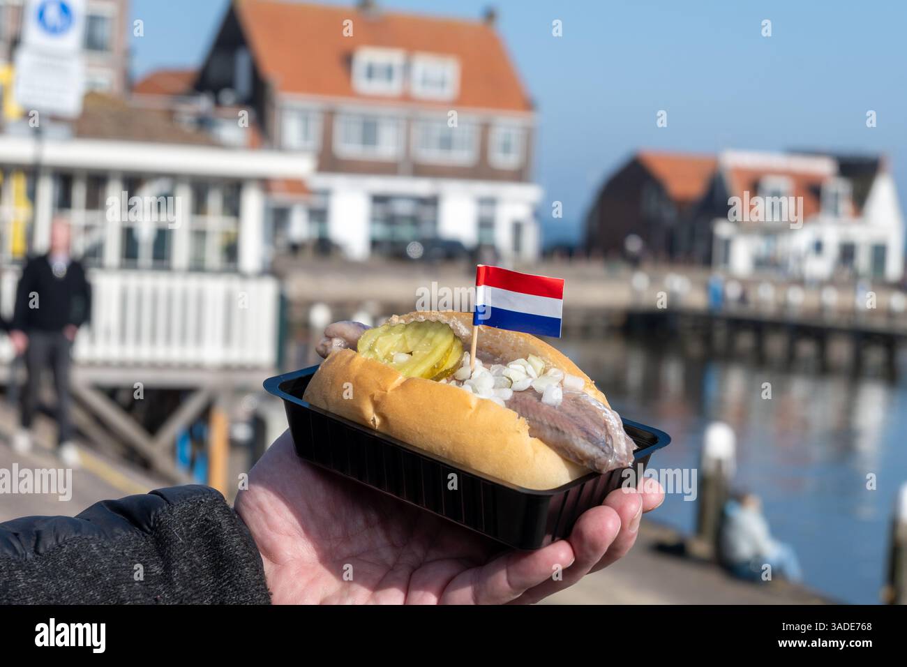 Famous barrel salted herring fish from the North Sea, fresh bun with ...