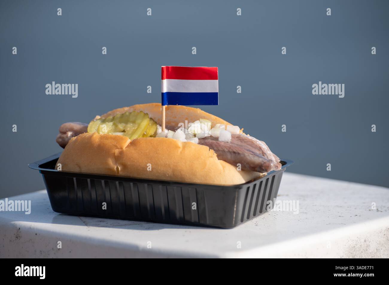 Famous barrel salted herring fish from the North Sea, fresh bun with ...