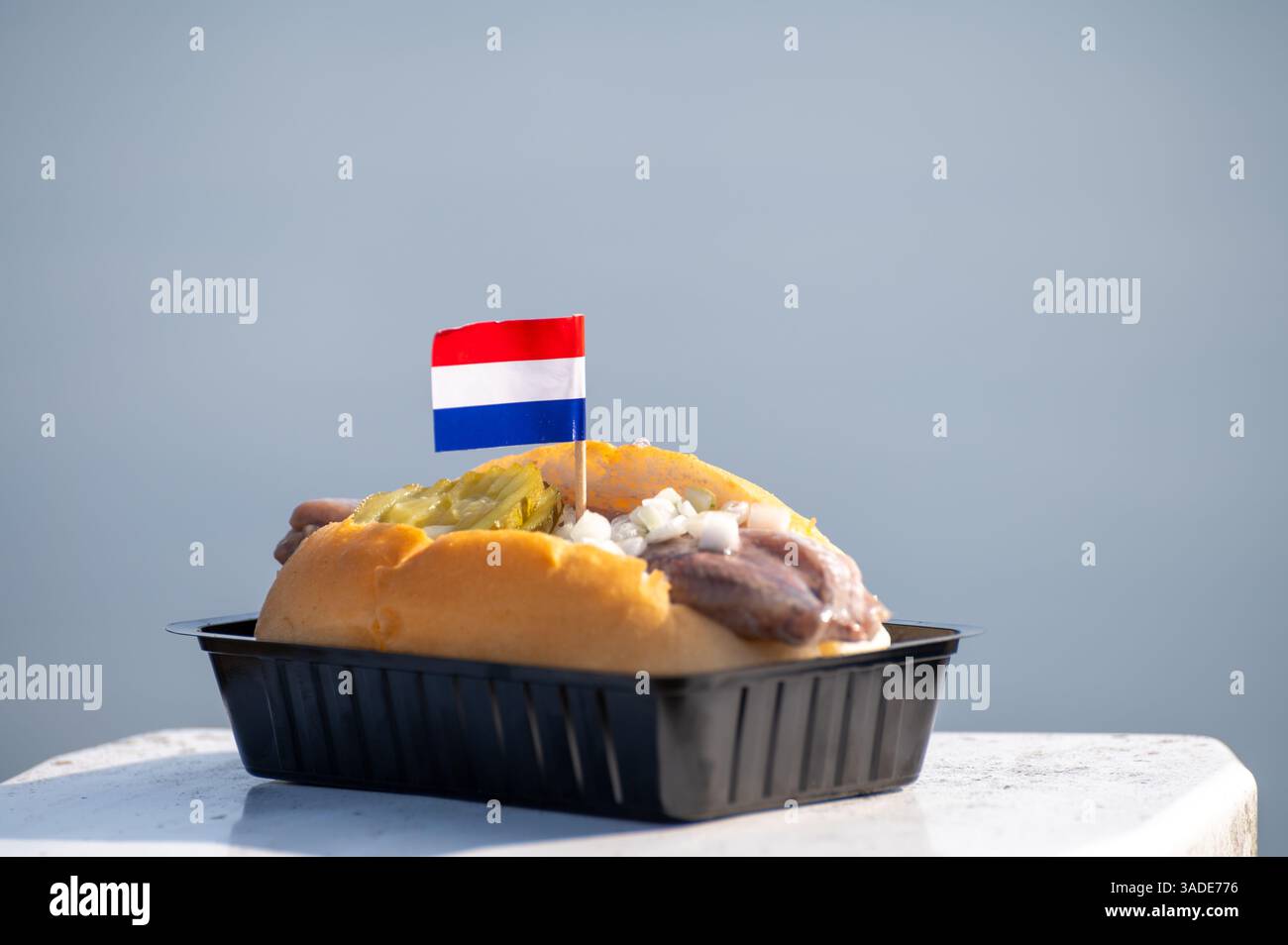 Famous barrel salted herring fish from the North Sea, fresh bun with ...