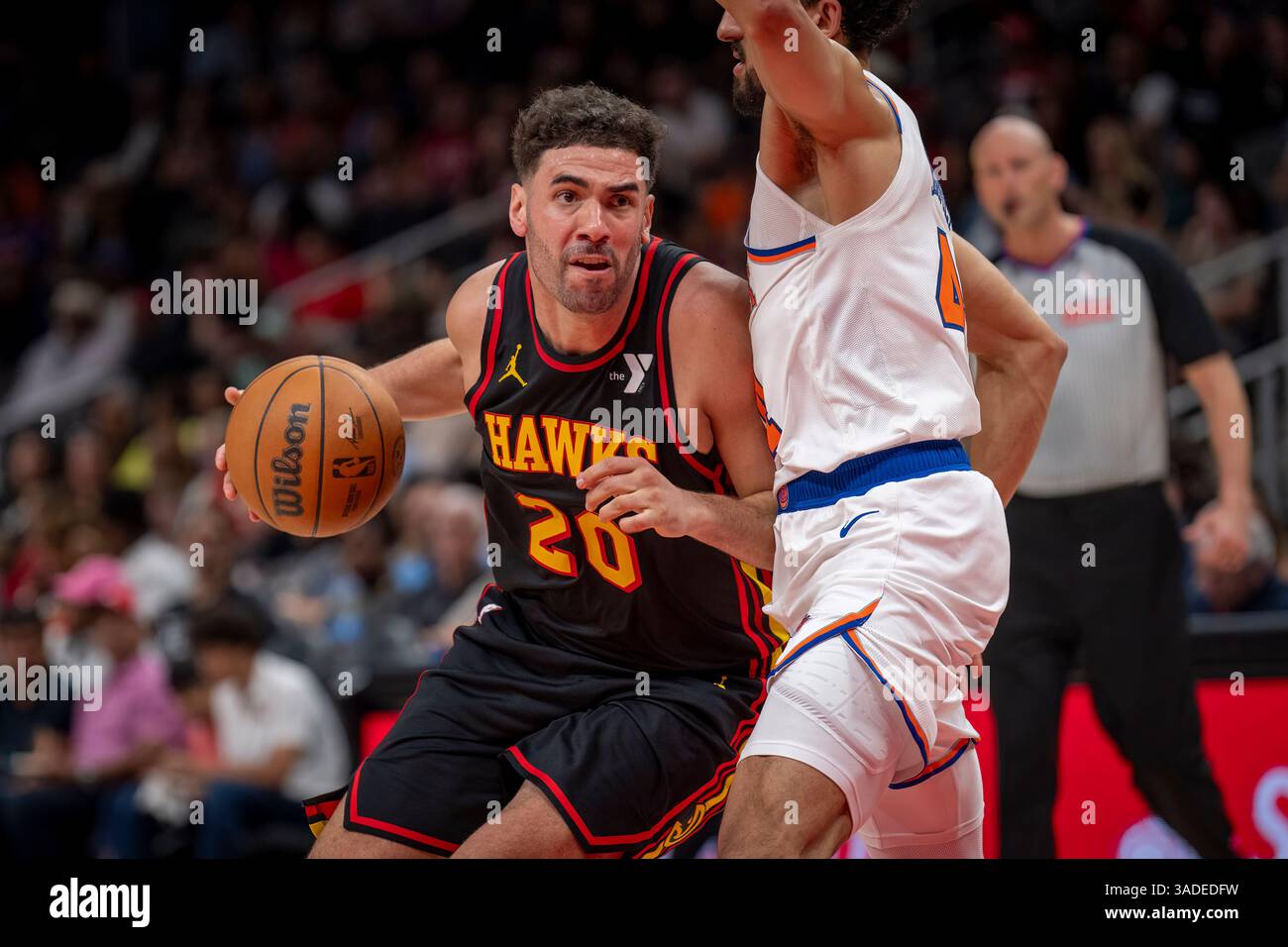 Atlanta Hawks forward Georges Niang, left, drives the ball down court against New York Knicks ...