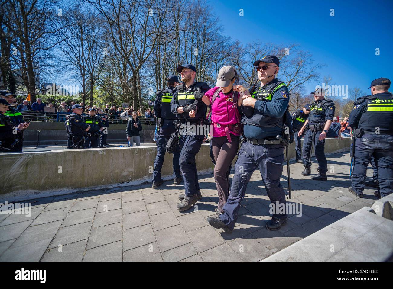 Police officers arrest a Female protester during the Extinction ...
