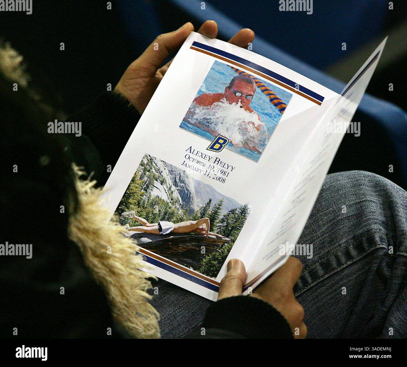 Woman holds event program hi-res stock photography and images - Alamy