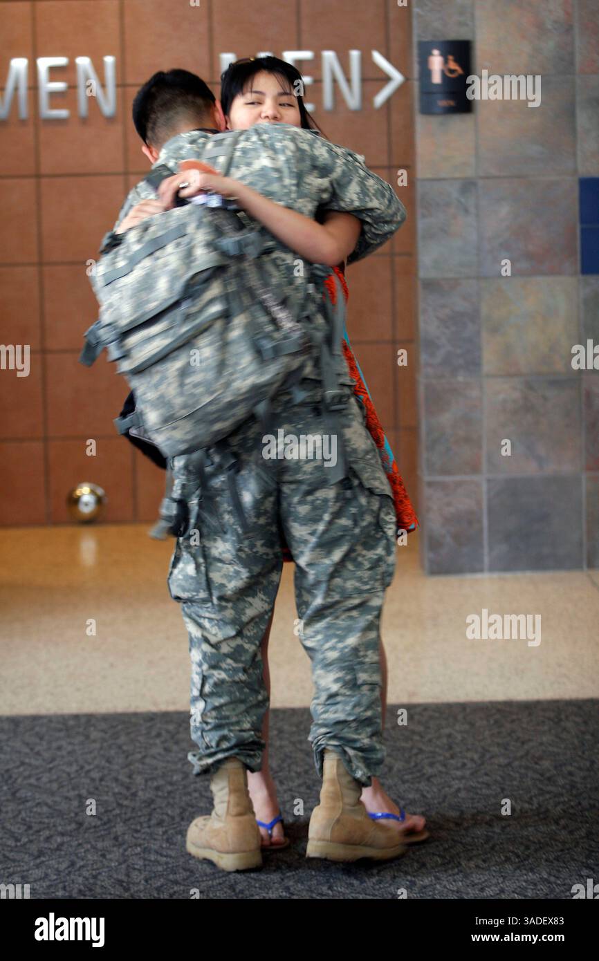 CoCo Walters / The Californian.Chris Palisoc and his wife Nicole hug in ...