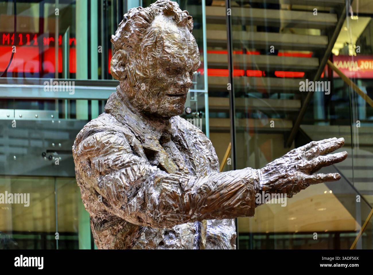 Bronze statue of a man in a modern lobby of a building, Willy-Brandt ...