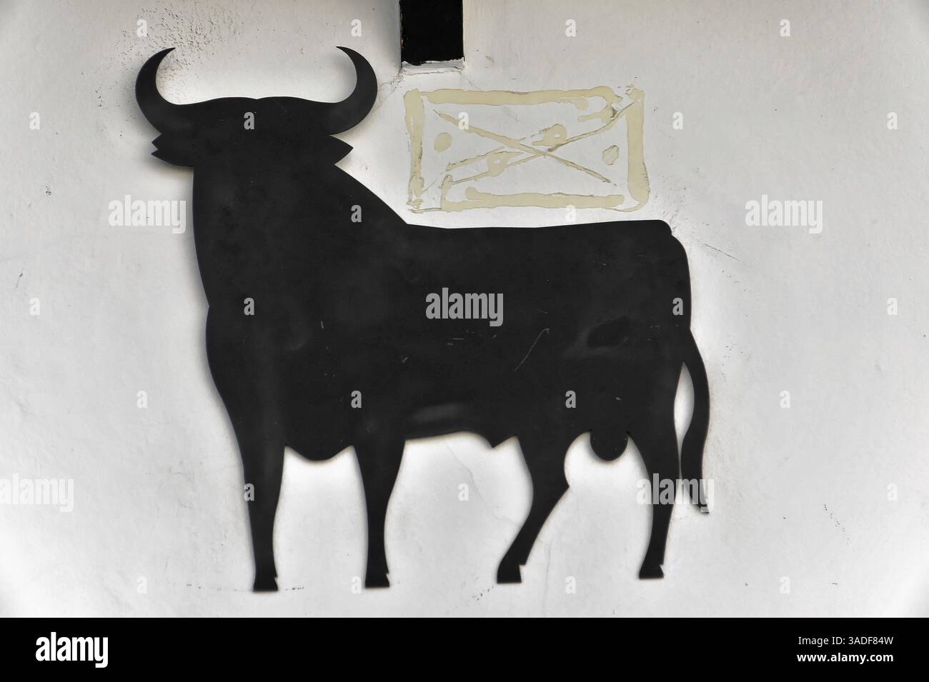 Black bull silhouette on a white wall as a symbol, Impressions from ...