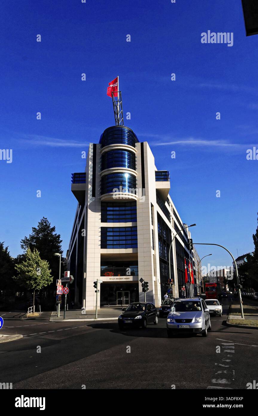 Red SPD flag flies on a modern building under a clear blue sky, Willy ...