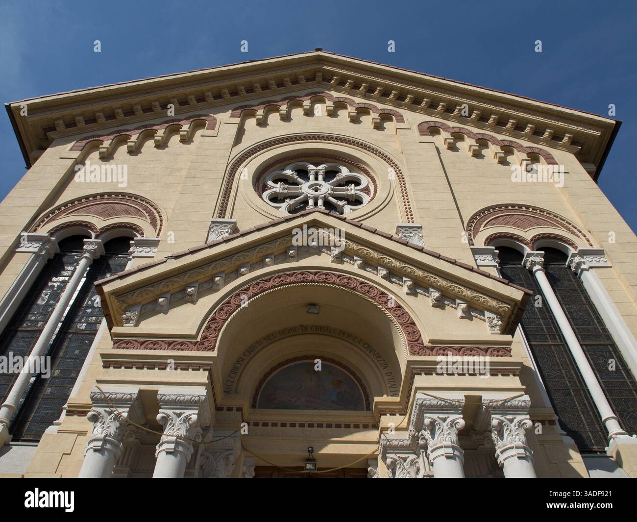 Detail of the facade of a Romanesque church with rose windows and ...