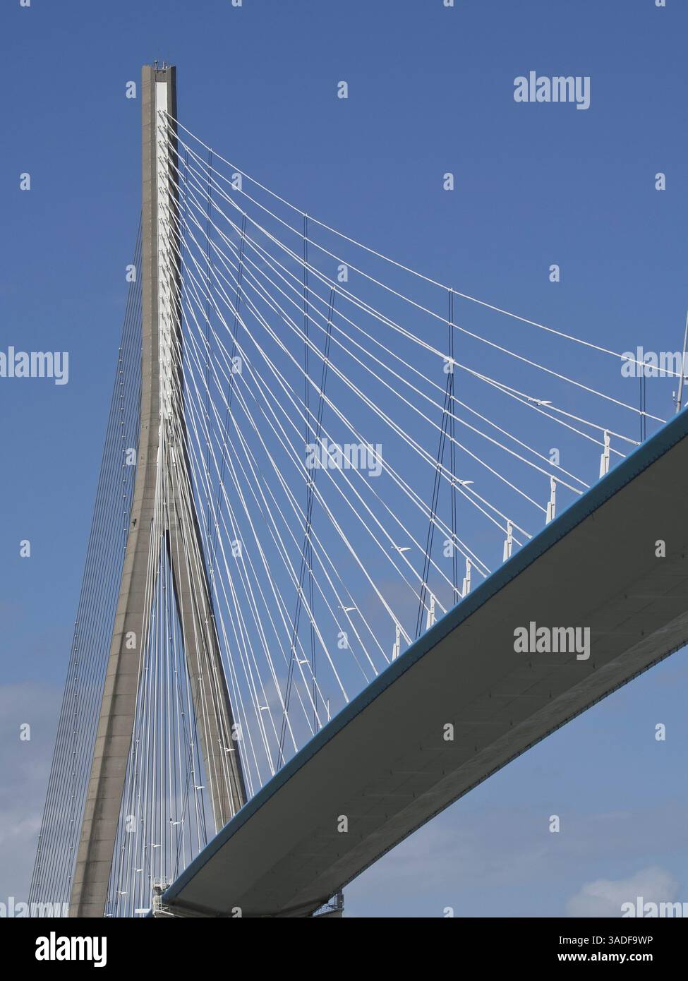 Elegantly designed suspension bridge in front of a clear sky, Rouen ...