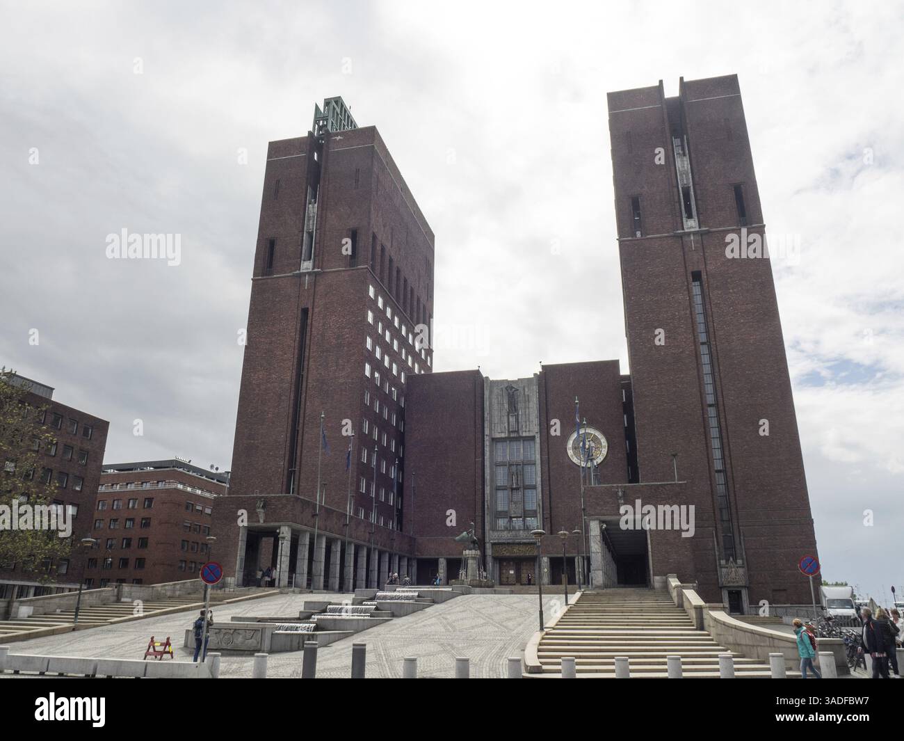 Two tall, rectangular buildings with a dominant architecture under a ...