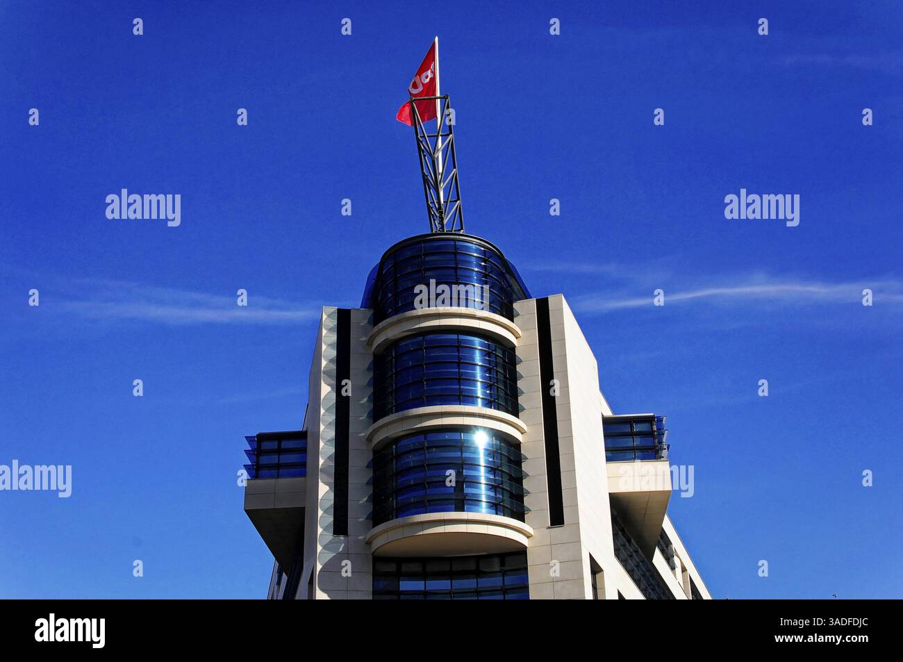 Red SPD flag flying on a modern building under a clear blue sky, Willy ...
