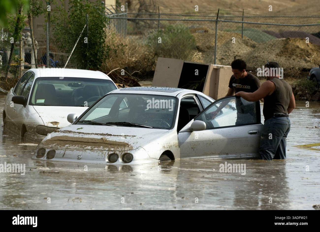 Aug 14, 2004; Victorville, CA, USA; Flash flooding buried cars in water ...