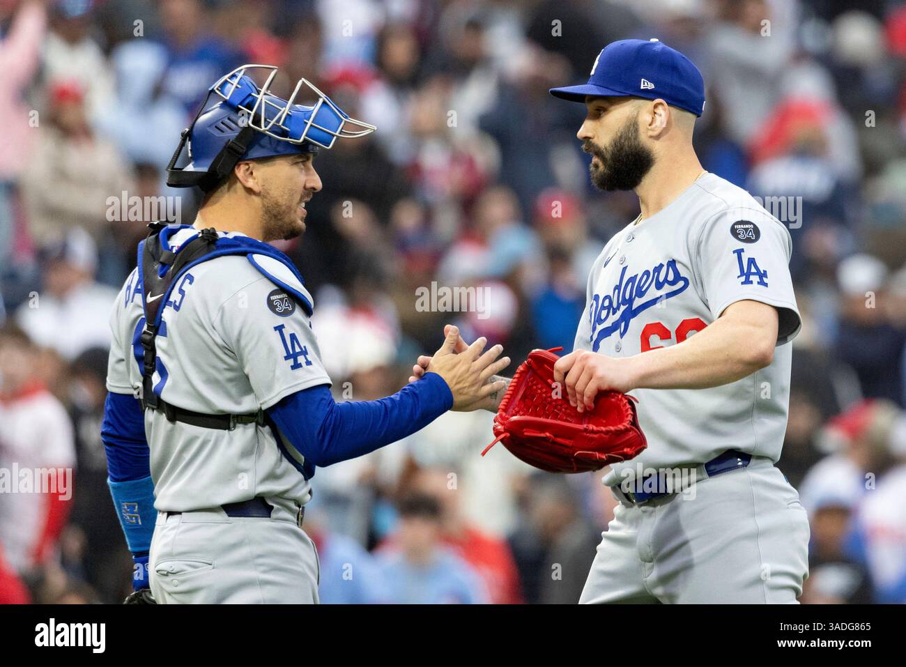 Los Angeles Dodgers catcher Austin Barnes, left, and closing pitcher ...