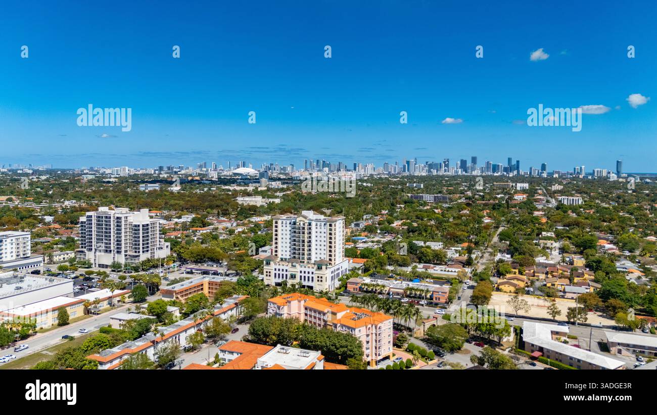 Aerial view of Coral Gables neighborhoods with the Miami skyline rising ...