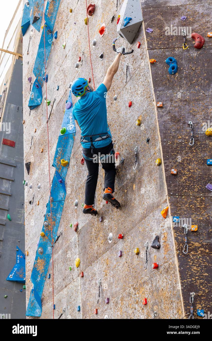 Climber on the climbing wall. Drytooling and artificial ice climbing ...
