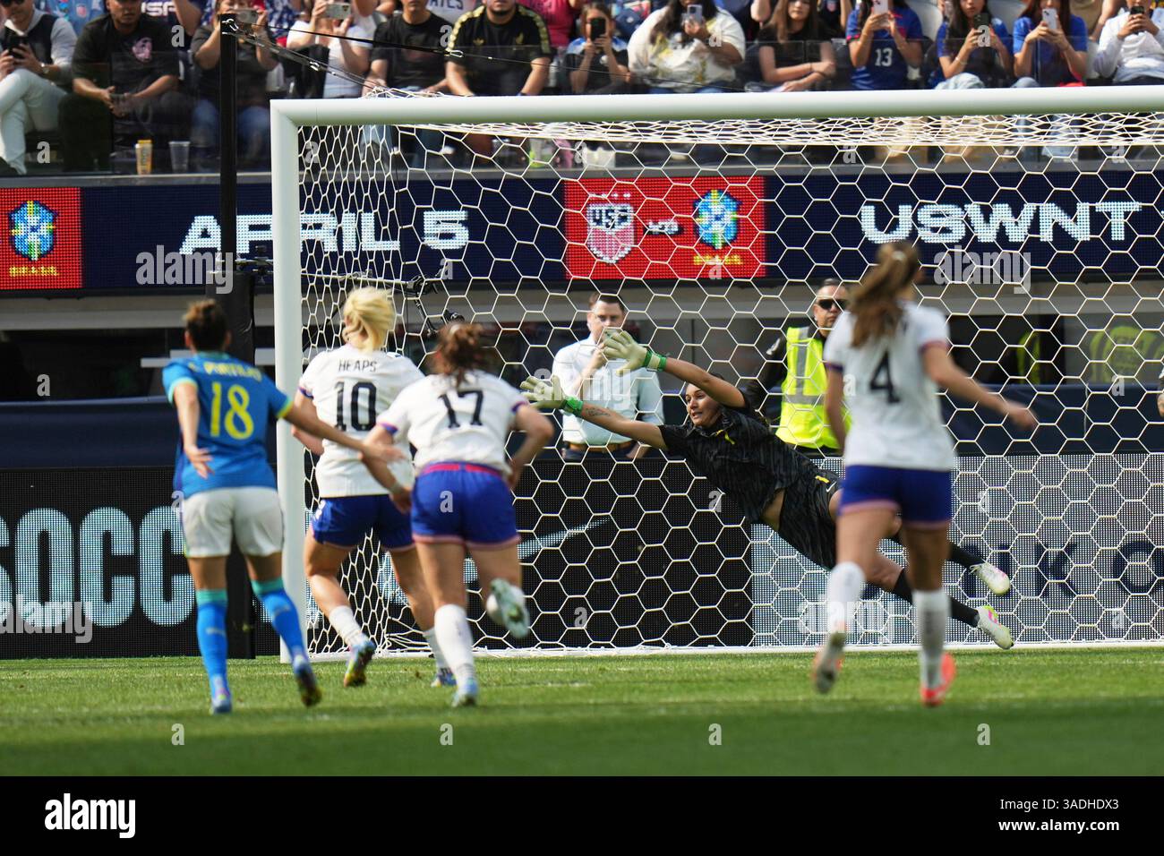 United States midfielder Lindsey Heaps (10) scores on a penalty kick ...