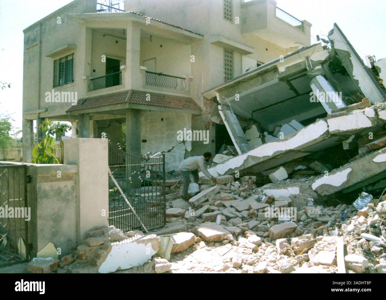 Feb 02, 2001; Ahmedabad, India; Cranes clear up rubble & debris from ...