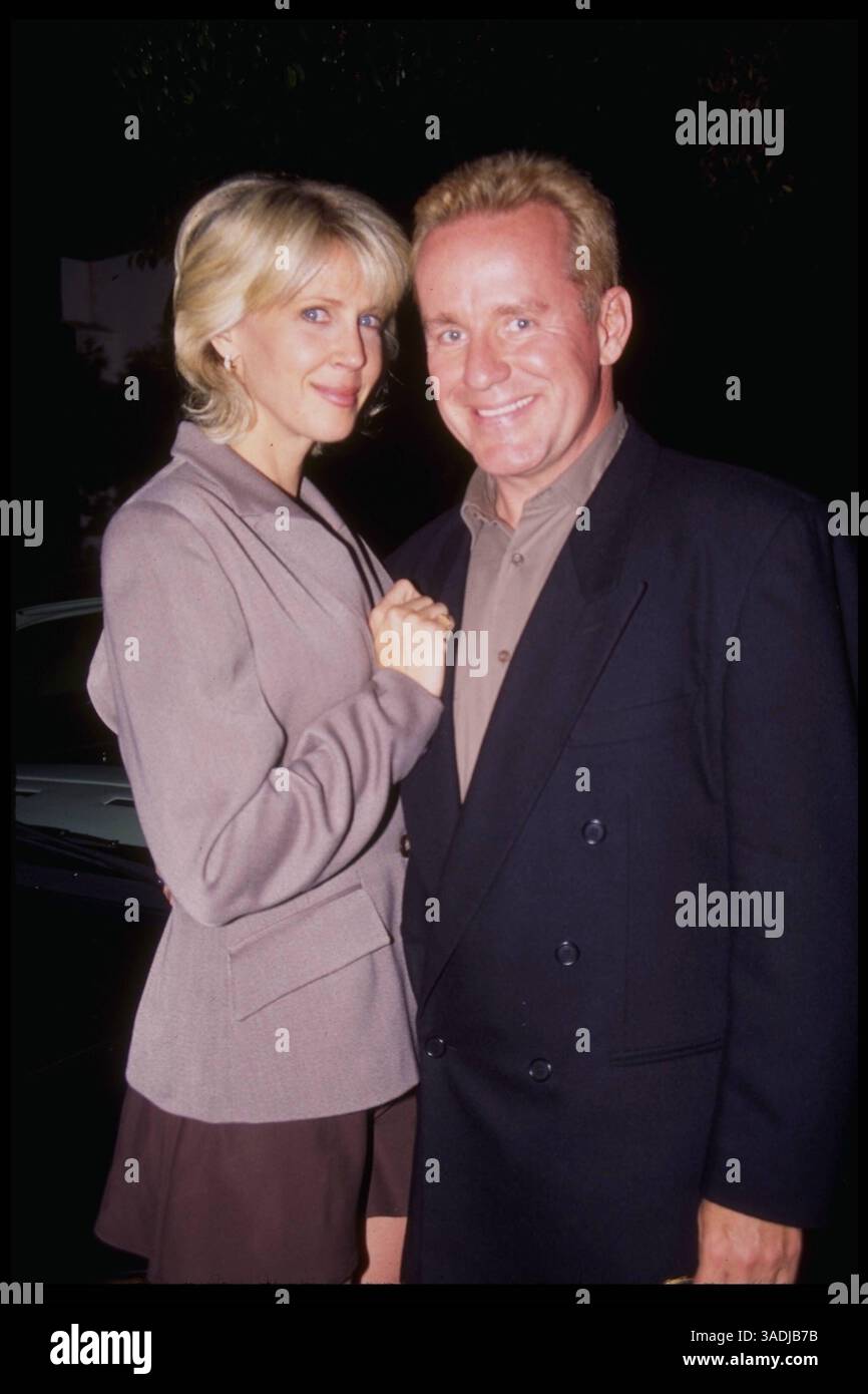 PHIL HARTMAN and wife BRYNN HARTMAN are shown in a 1995 photo ...