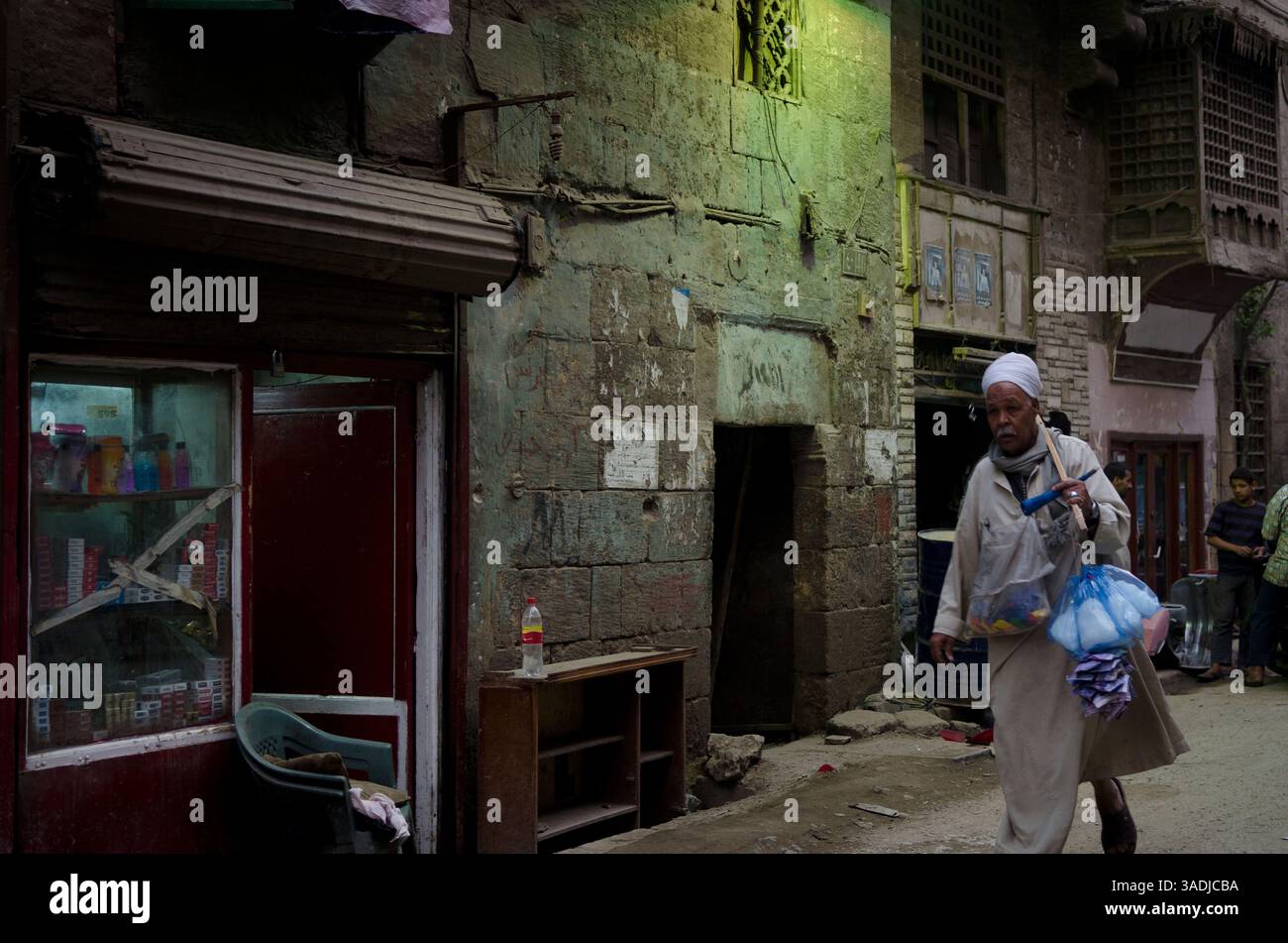Oct 31, 2011 - Cairo, Egypt - Old man sells kitchen ware door to door. As Egypt takes its first ...