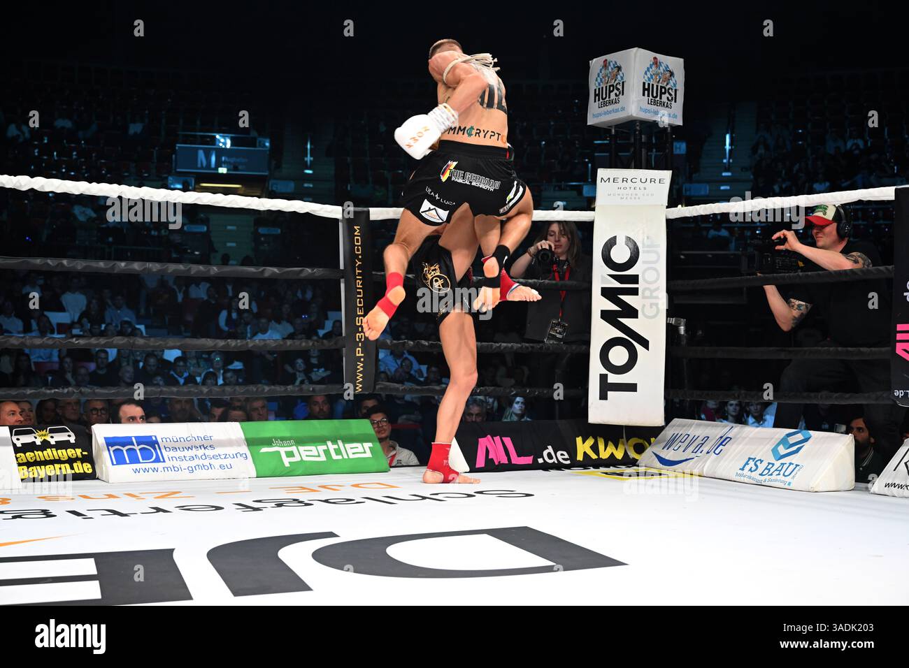 Munich, Germany. 05th Apr, 2025. Kickboxers Pascal Schroth (front) and Karl Proderutti (back ...