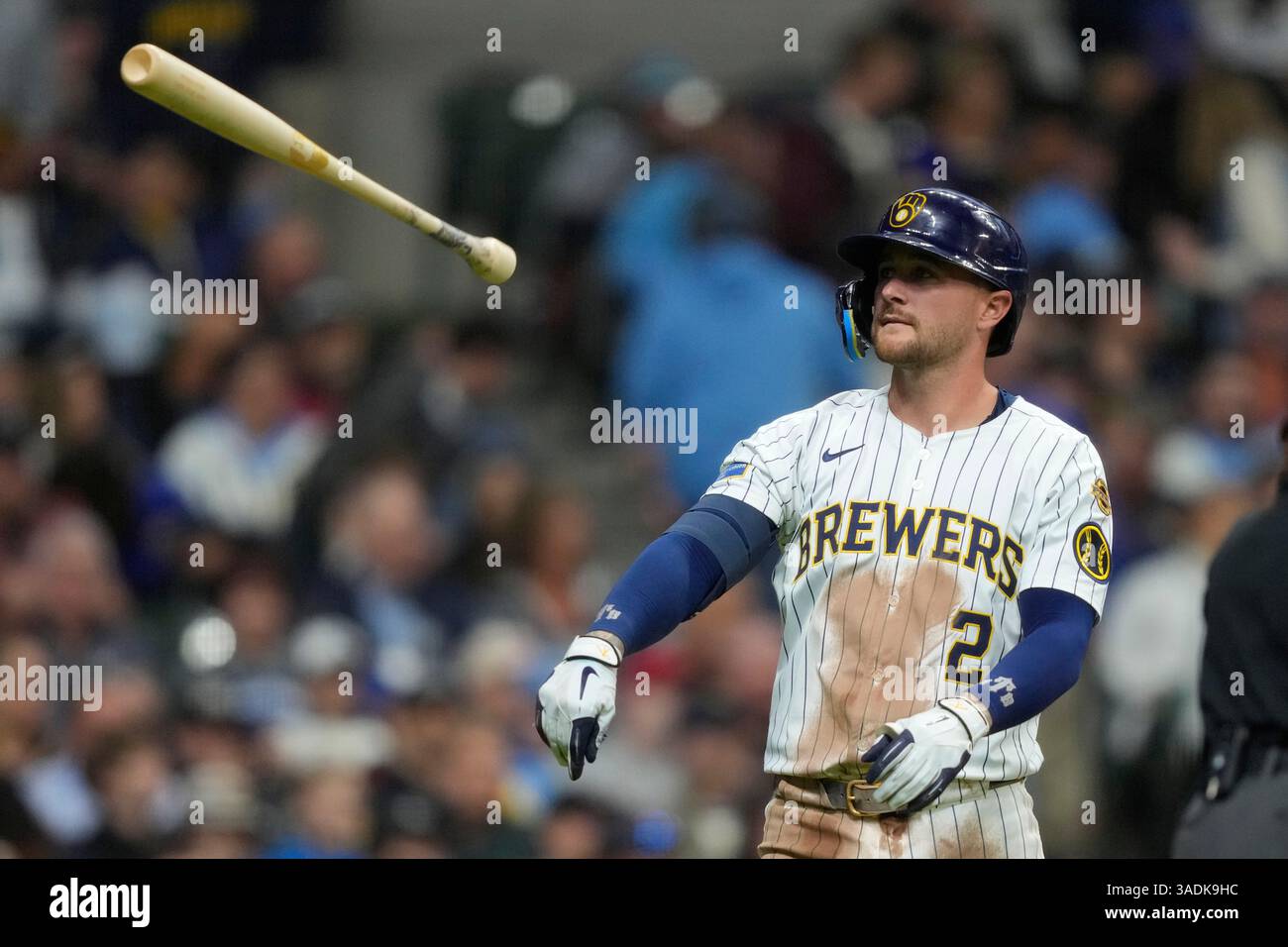 Milwaukee Brewers' Brice Turang tosses his bat after striking out ...