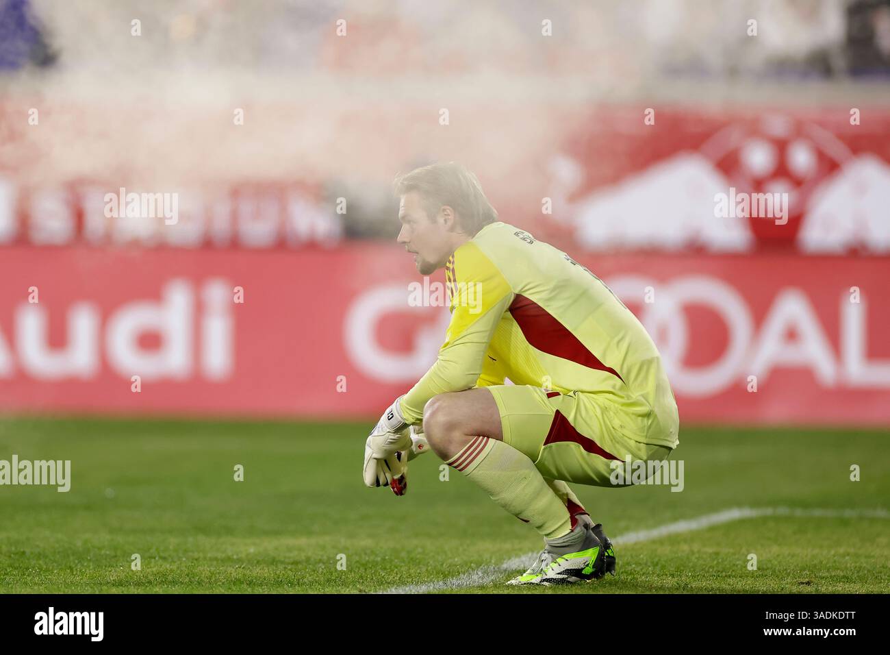 Chicago Fire goalkeeper Chris Brady reacts surrounded by smoke after ...