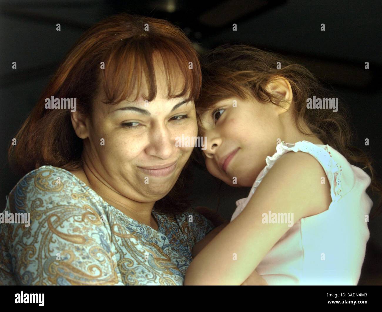 Apr 16, 2004; Philadelphia, PA, USA; DELIMAR VERA gazes at her mother ...