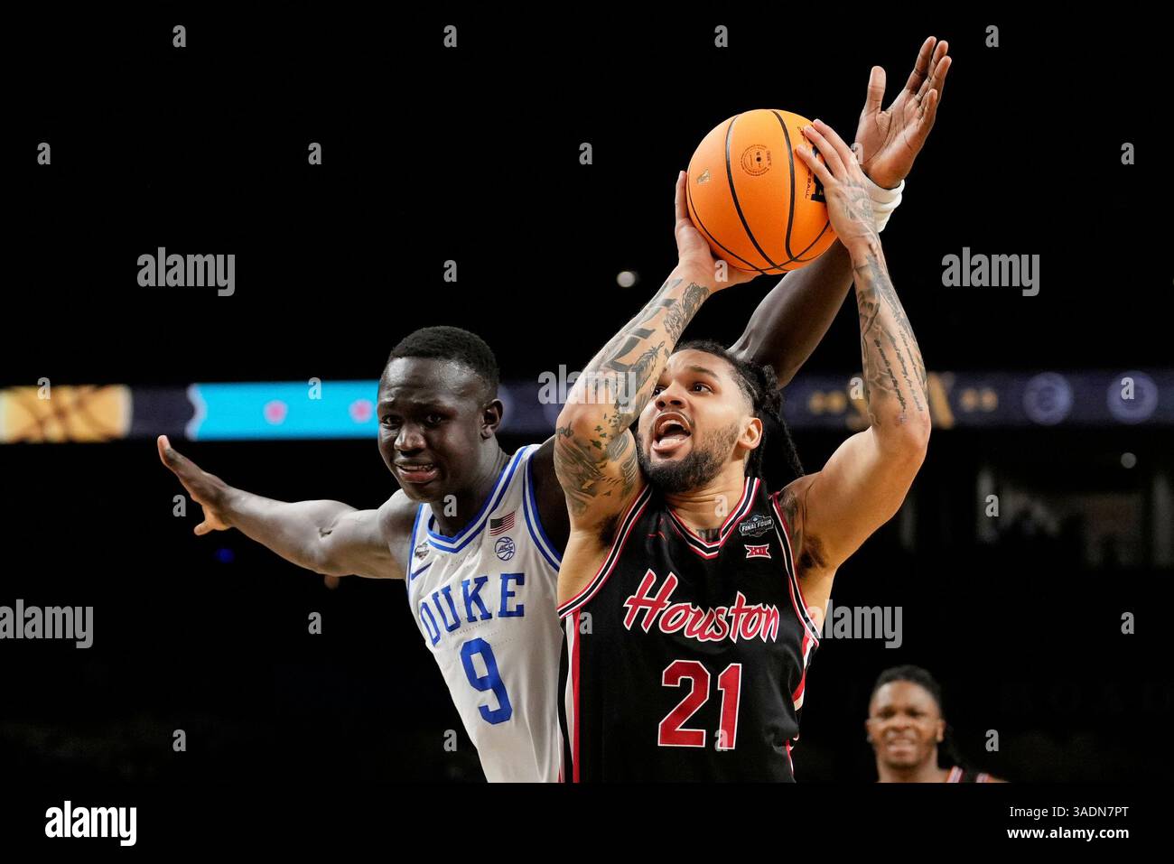 Houston guard Emanuel Sharp drives to the basket past Duke center ...