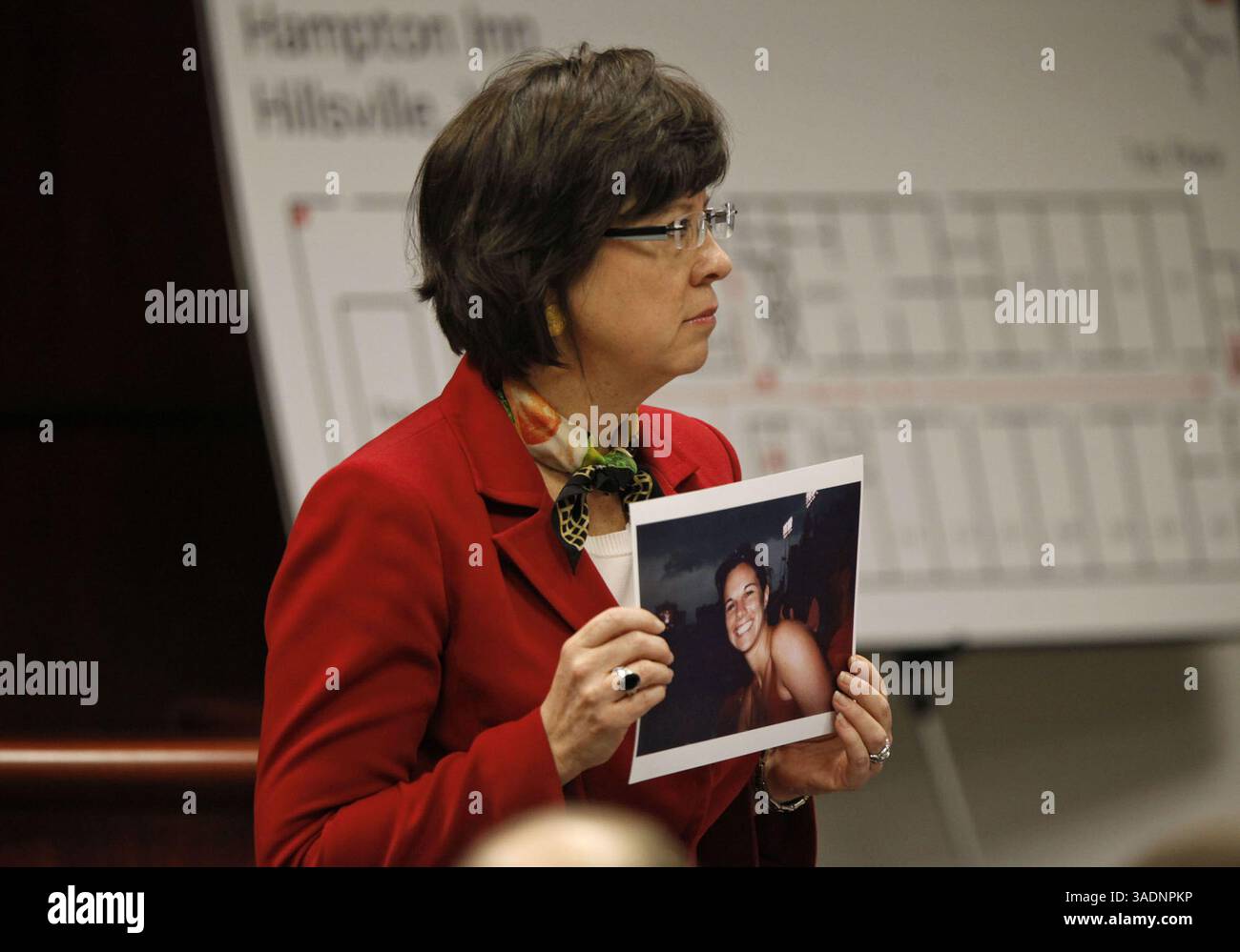 March 1, 2012 - Raleigh, NC, USA - Holding a photo of Michelle Young ...