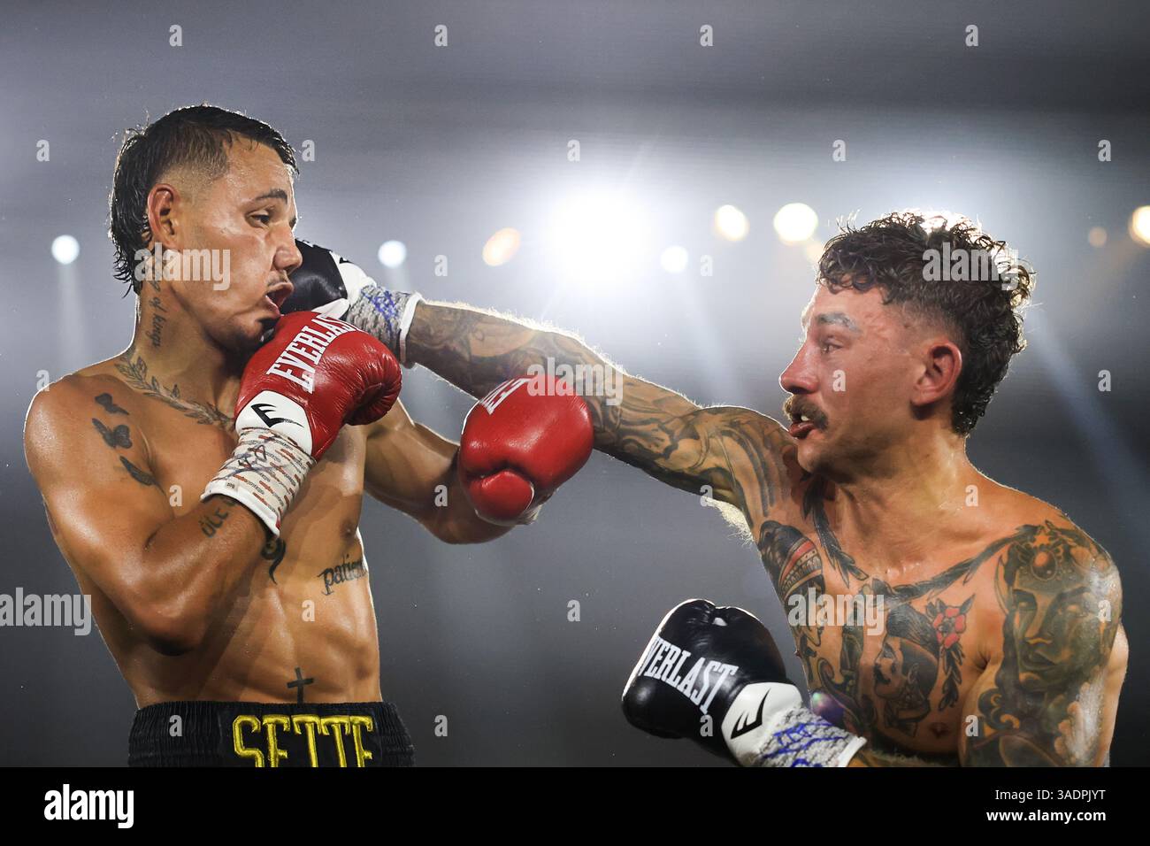 Brent Walton (R) throws a punch in the prelim bout between Brent Walton ...