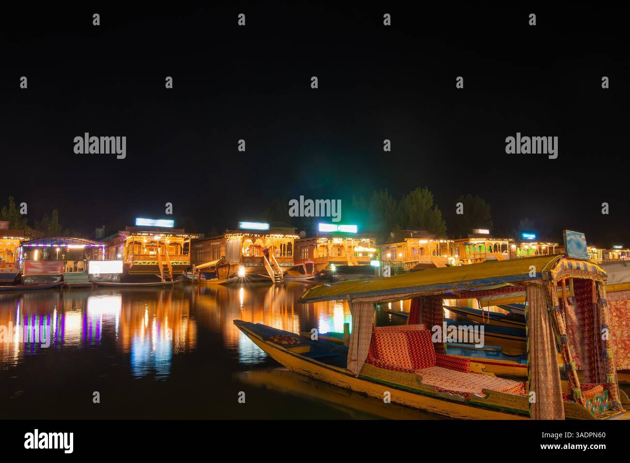 A late night view of the illuminated floating houseboats on Dal lake in ...