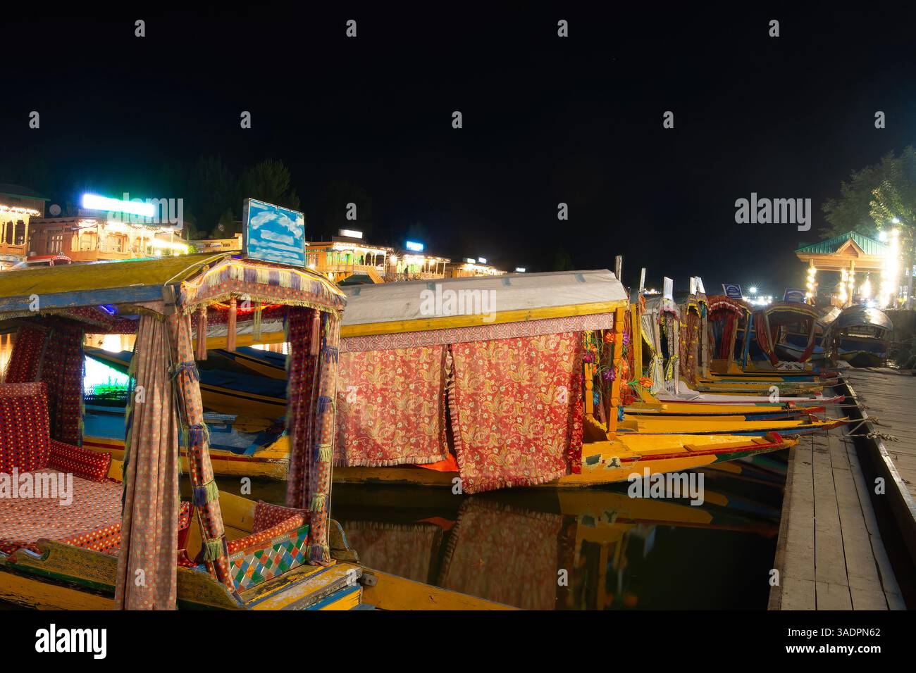 A late night view of the illuminated floating houseboats on Dal lake in ...