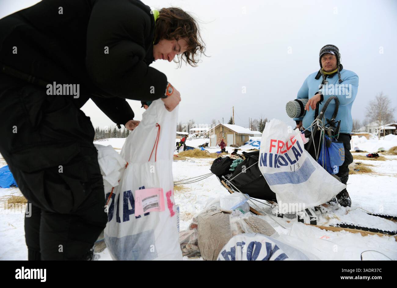 March 6, 2012 - Nikolai, AK, USA - Martin Buser, right, talks with his ...