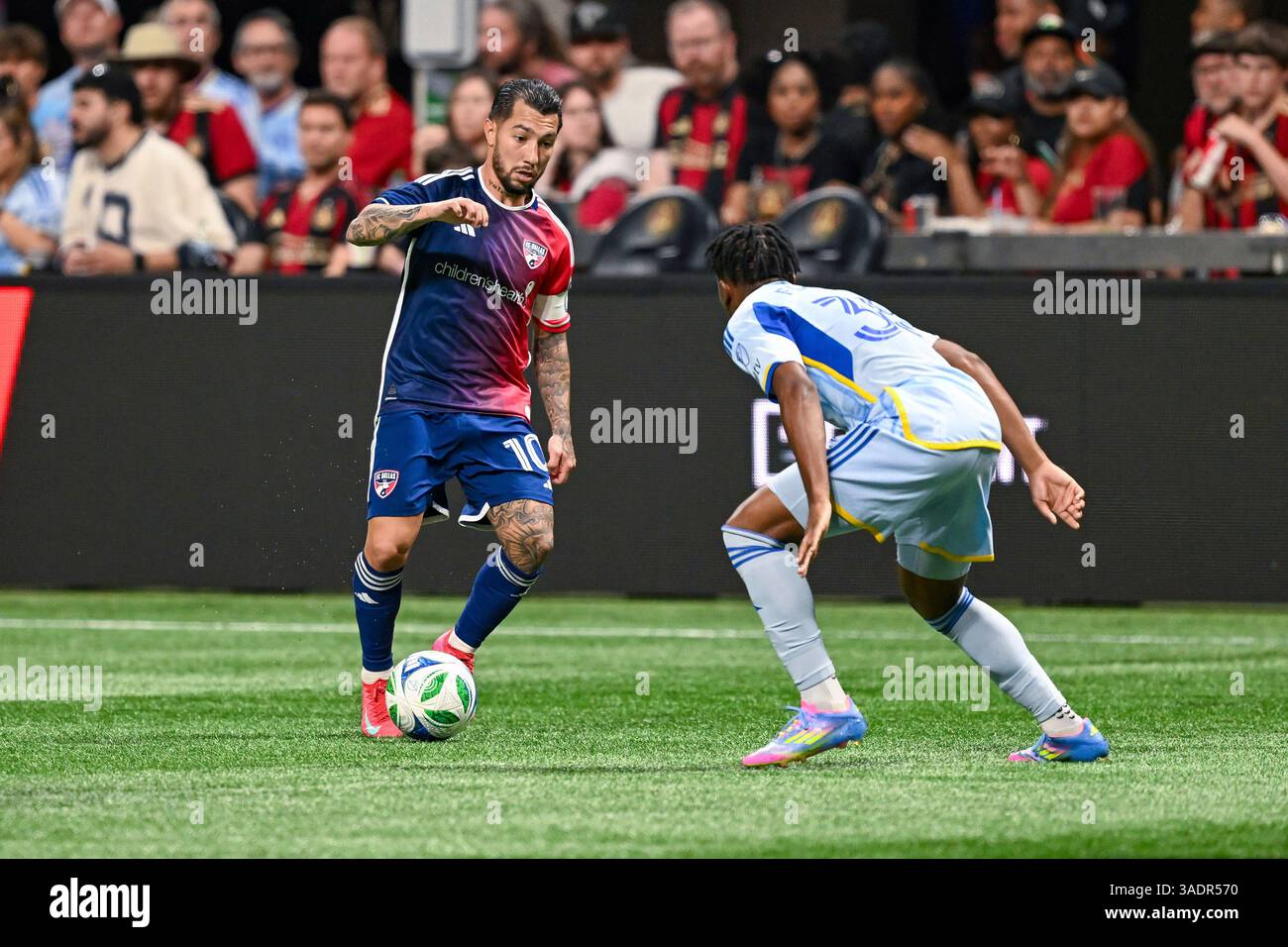 ATLANTA, GA – APRIL 05: Luciano Acosta #10 of Dallas looks to move by ...