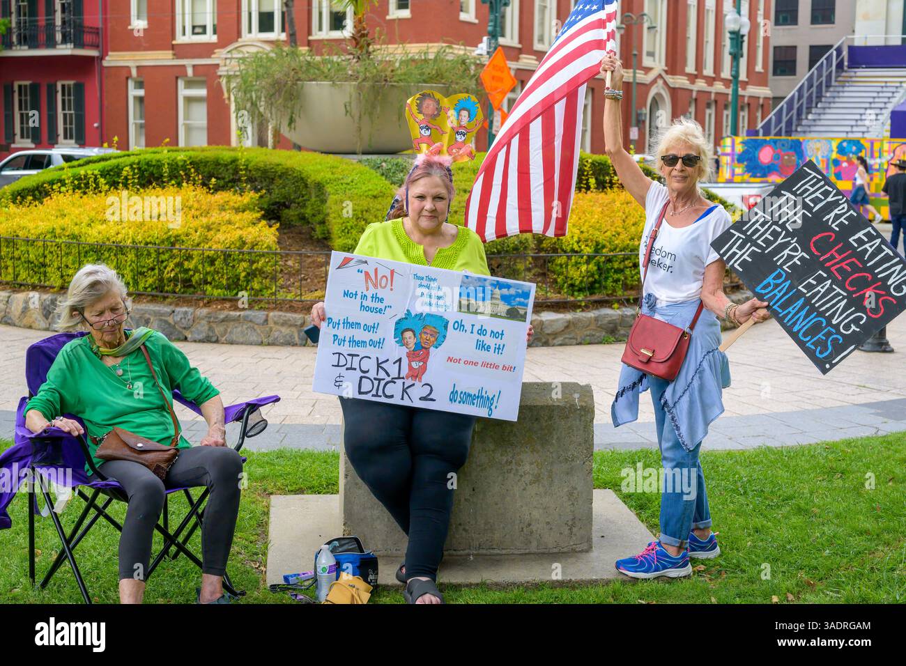 New Orleans, LA, USA - April 5, 2025: Protesters with signs and flag at ...