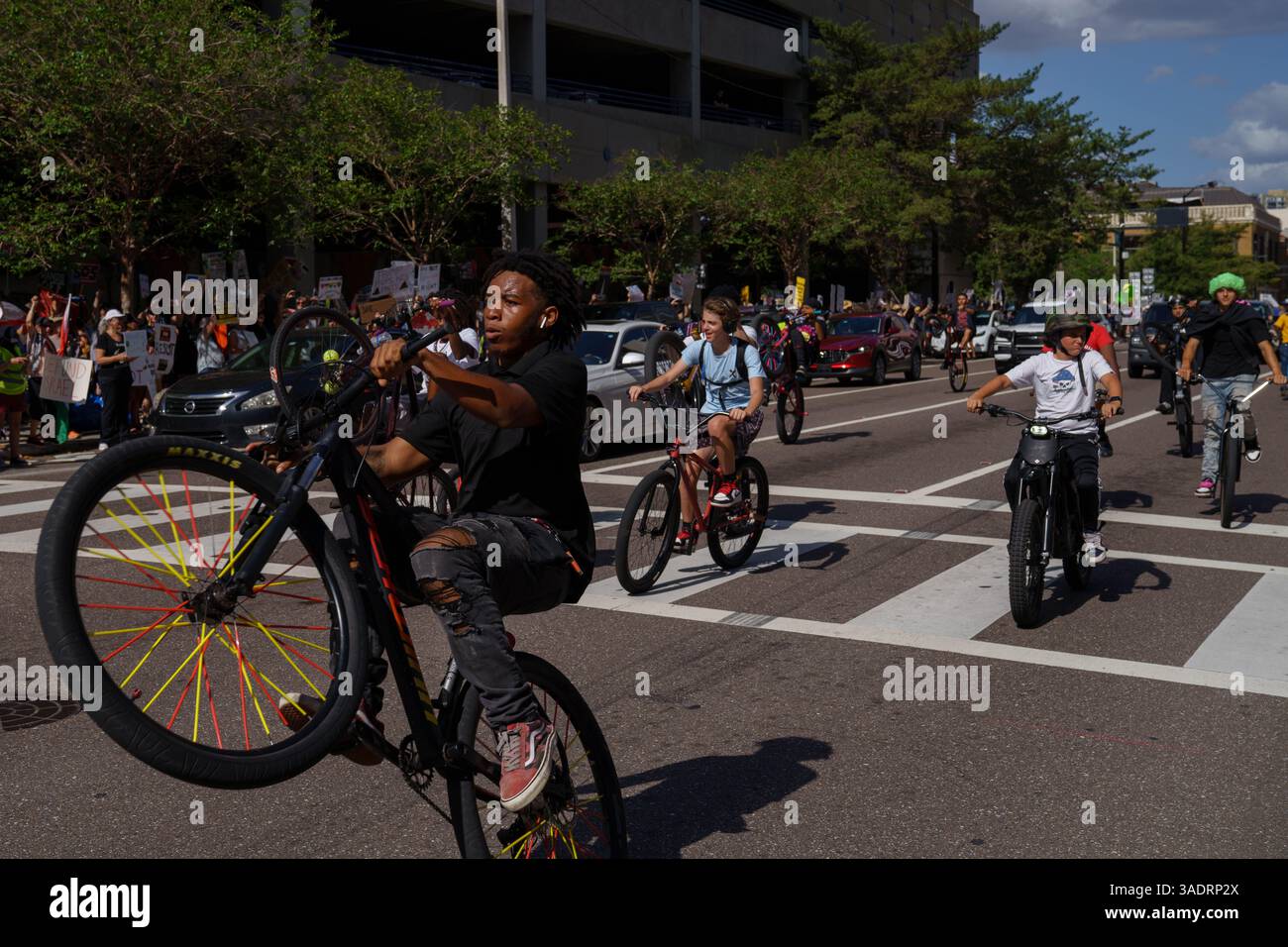 St Petersburg, Florida, USA. 5th Apr, 2025. A boy pops a wheely on his ...