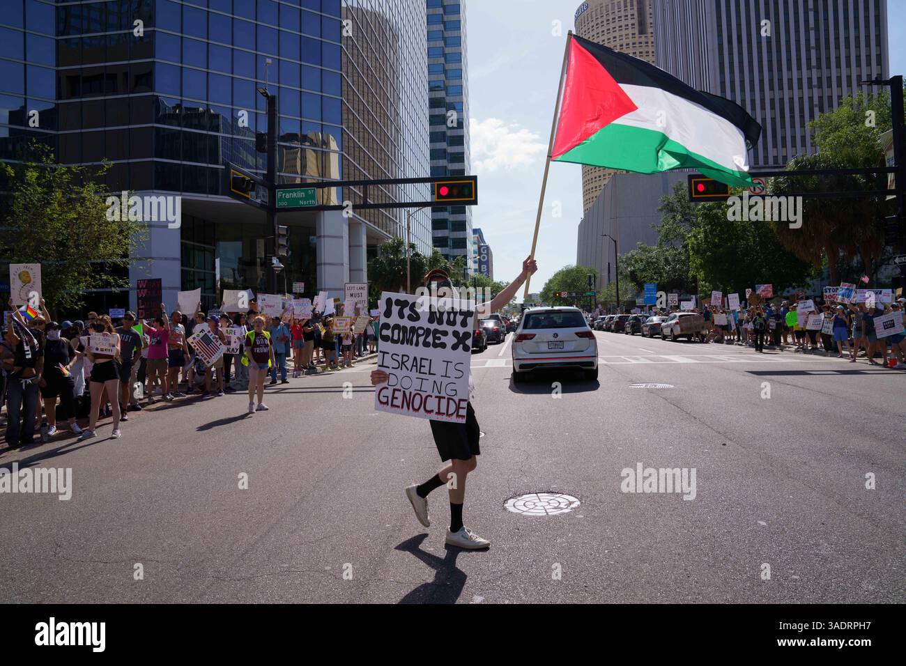 St Petersburg, Florida, USA. 5th Apr, 2025. A proteser waves a ...