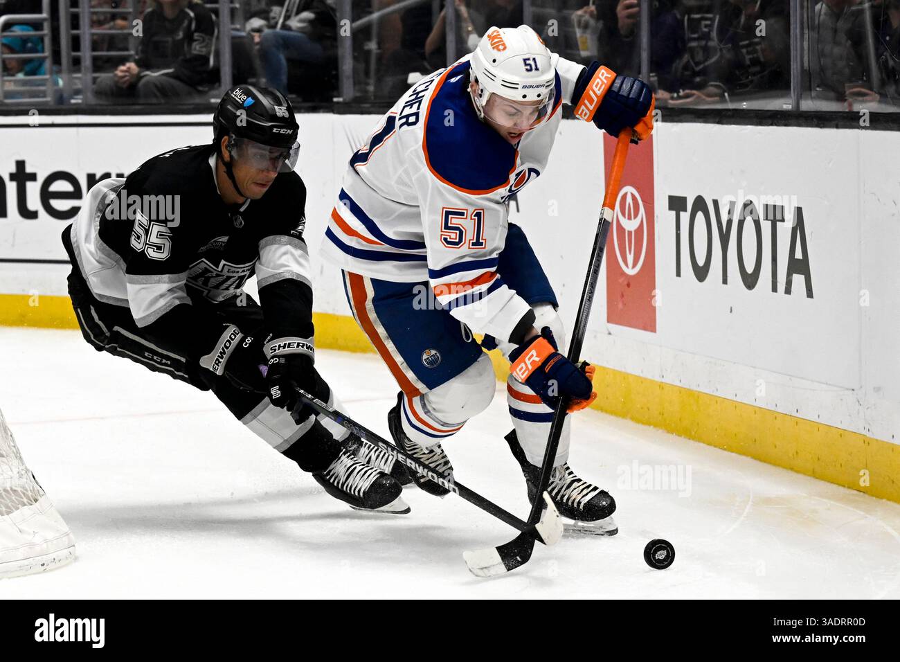 Los Angeles Kings right wing Quinton Byfield (55) puts pressure on Edmonton Oilers defenseman ...