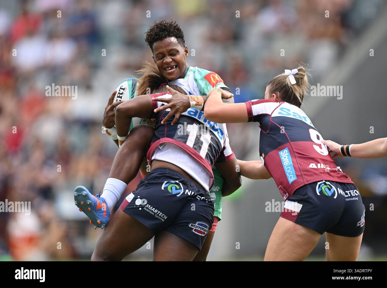 Brisbane, Australia. 06th Apr, 2025. Ivania Wong of the Reds tackles ...
