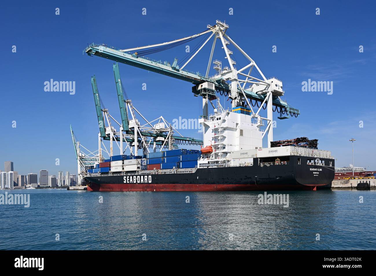 Miami, Florida - 01-29-2025: Cargo ships being loaded with containers ...