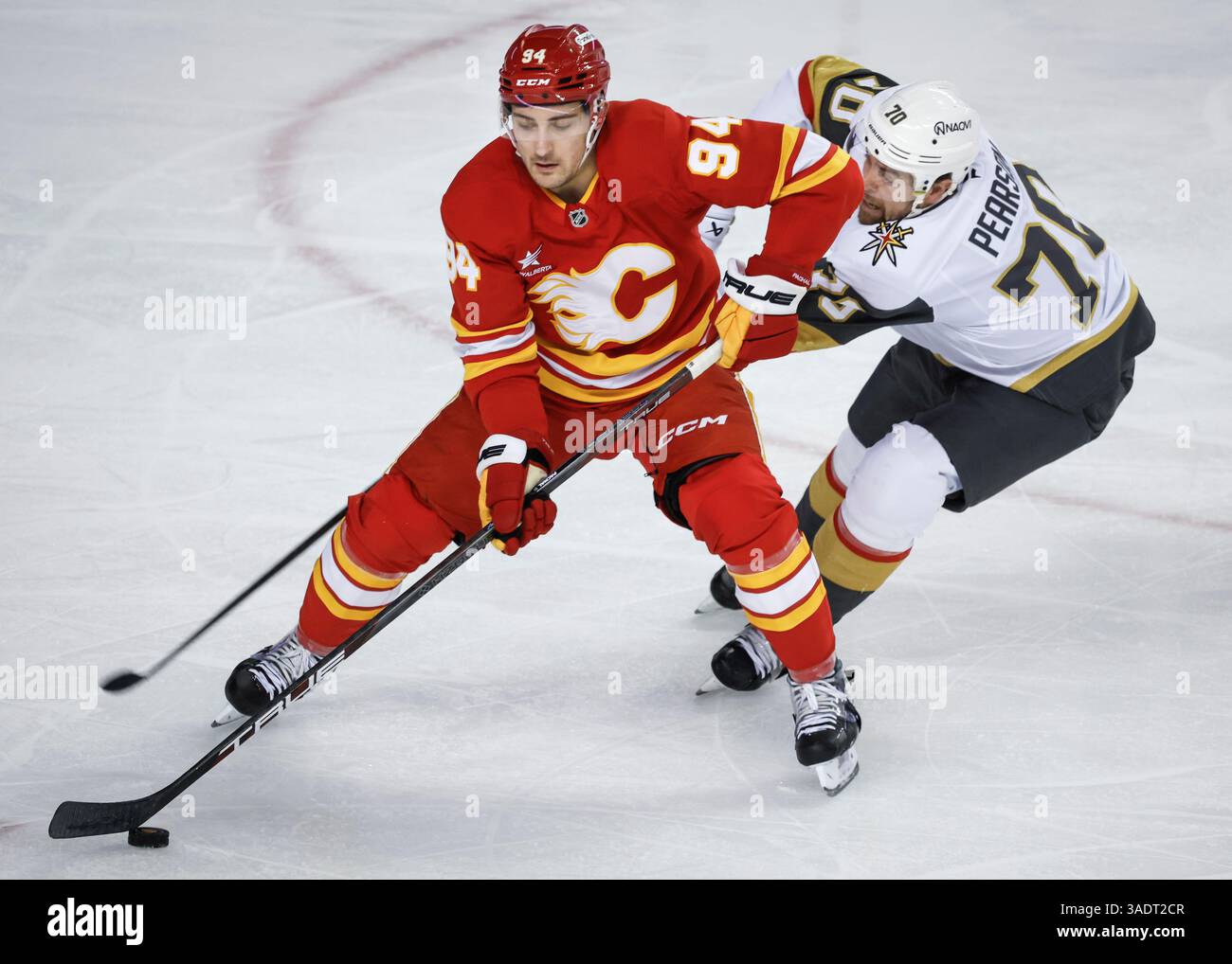 Vegas Golden Knights' Tanner Pearson, right, checks Calgary Flames ...