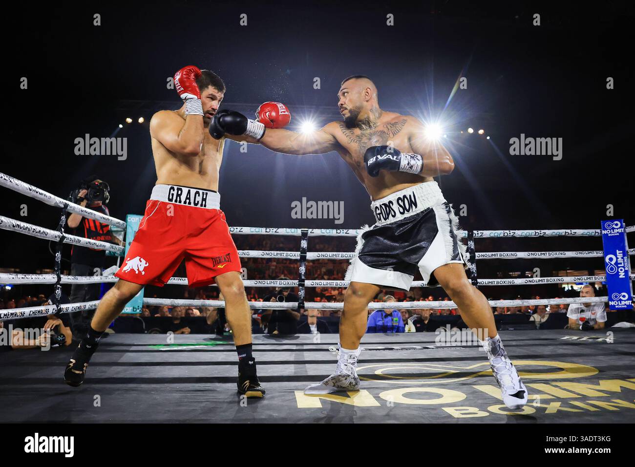 Liam Talivaa (R) throws a punch in the Australian Heavyweight Title ...