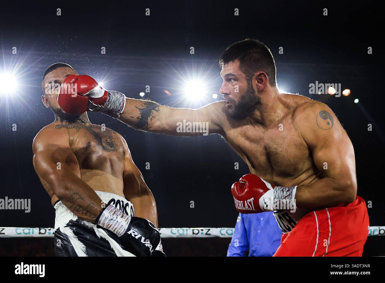 Brandon Grach (R) throws a punch in the Australian Heavyweight Title ...
