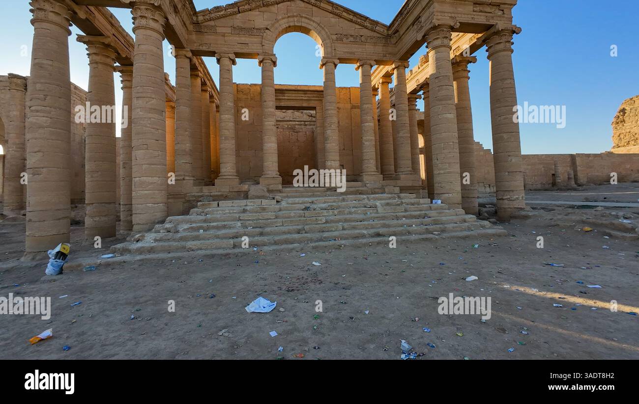 Ancient stone ruins with columns and arches under a clear blue sky ...