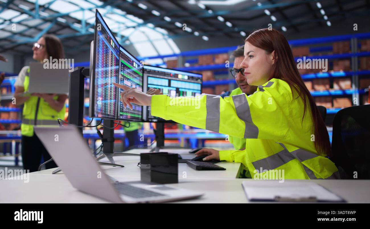 Inventory Manager Inputs Data On Computer Screen In Warehouse Office ...