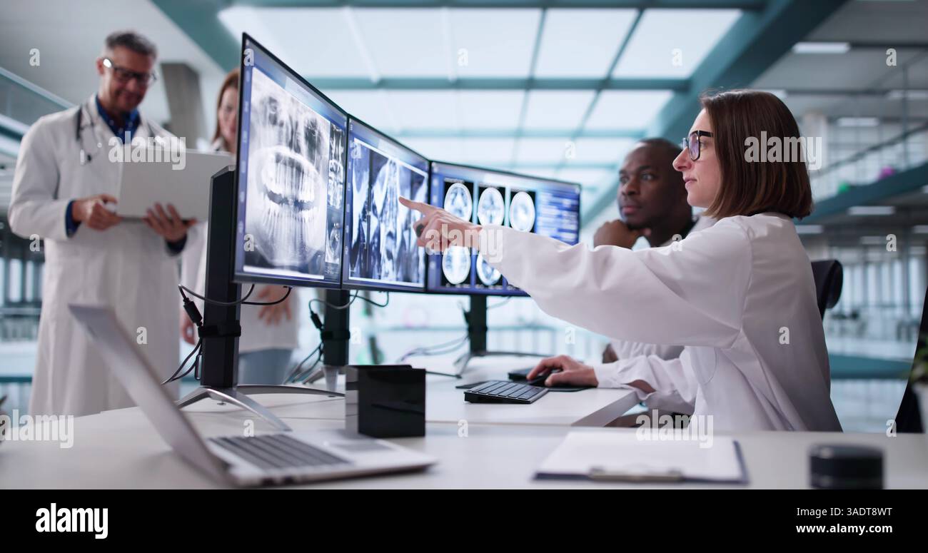 Medical Professionals Examine MRI Scans Of Brain In Hospital Clinic ...