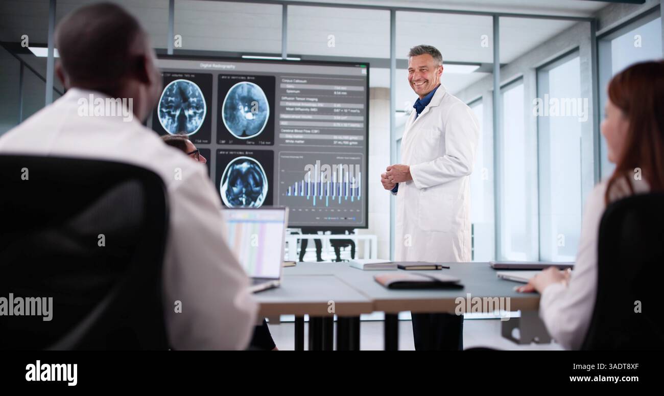 Medical Team Discusses MRI Imaging Results On TV Screen Together Stock Photo - Alamy