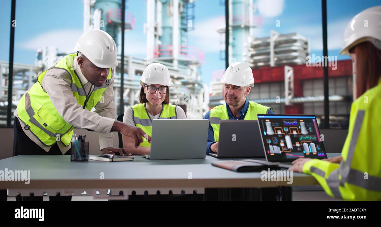Senior Manager Monitors Diverse Team At Oil Refinery Plant Stock Photo ...